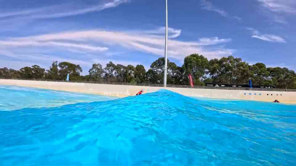 Santa hats look funny until the wave starts throwing you