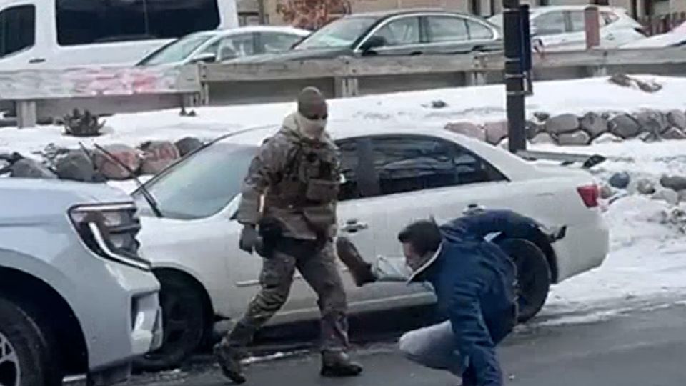 Man standing in front of ICE vehicle shoved by agent