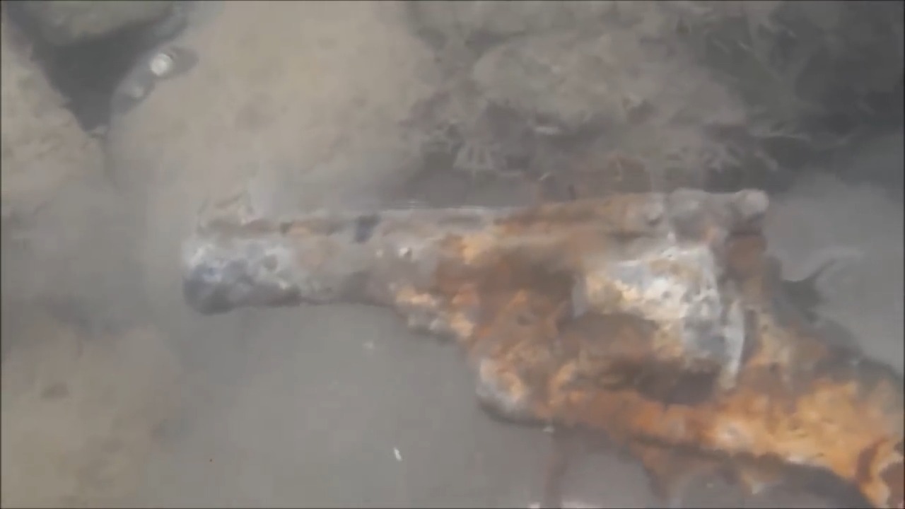 Metal detecting turned serious when another gun appeared