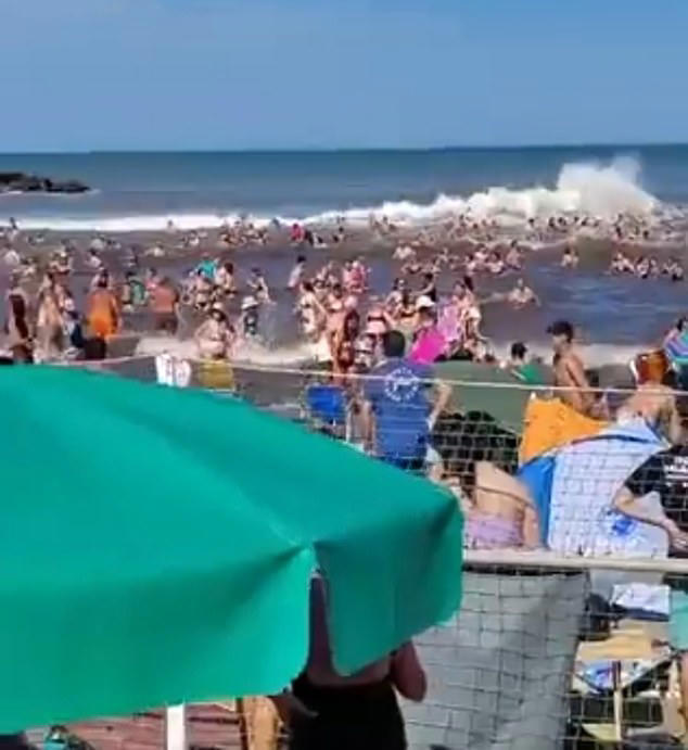 Freak 'meteotsunami' engulfs beach leaving one dead and dozens injured ...