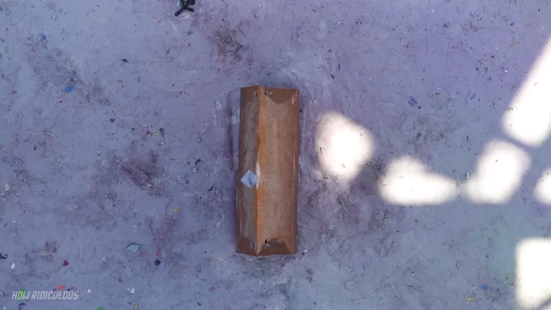 What will a giant axe do to a tungsten cube dropped from 150 feet?