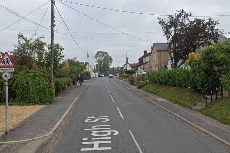 Two people rushed to hospital after crash which closed village road