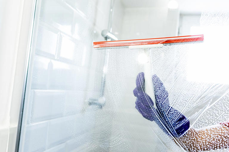 How to clean a glass shower door to keep grime at bay