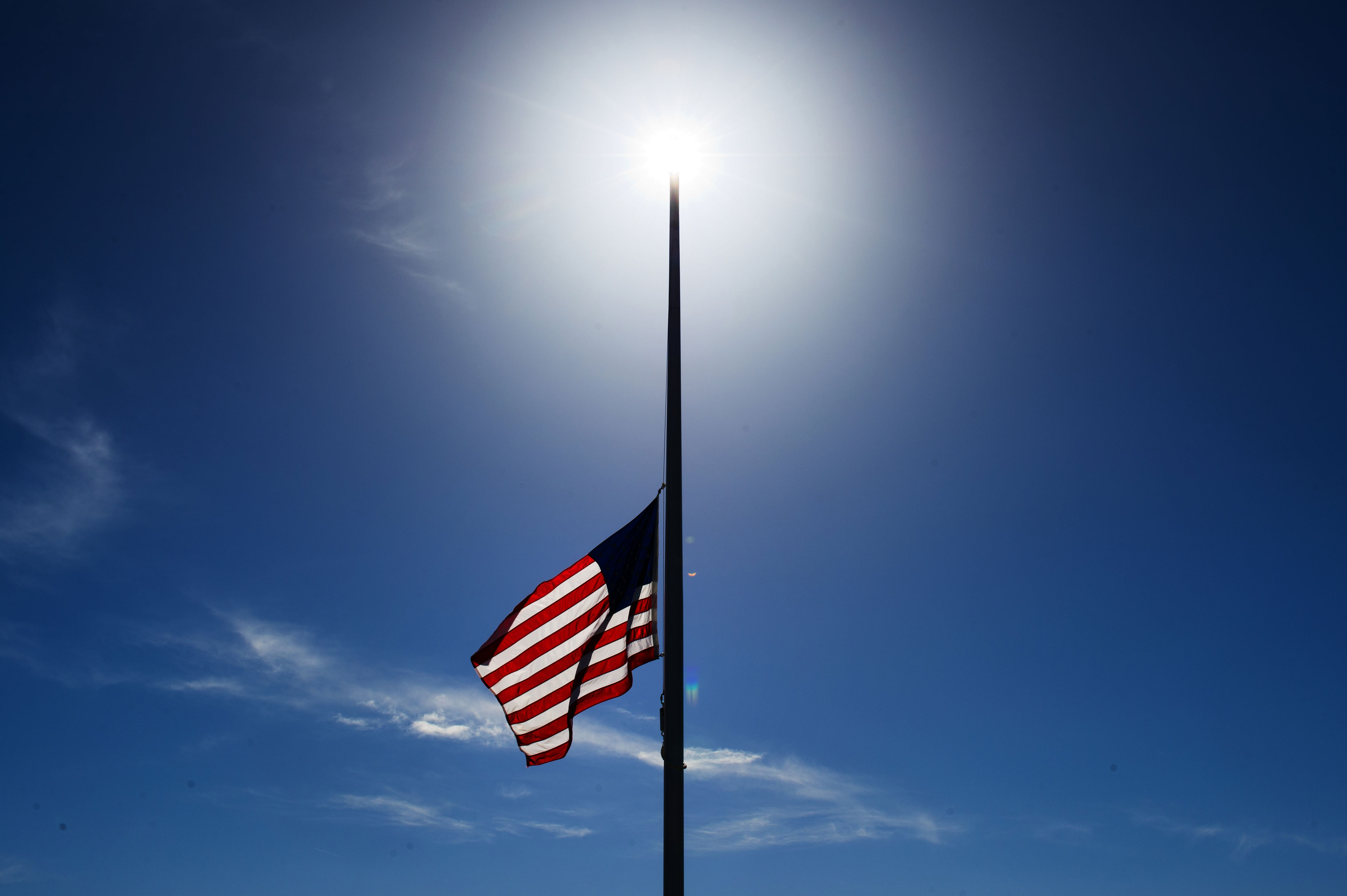 Why flags are at half-staff in 3 states today
