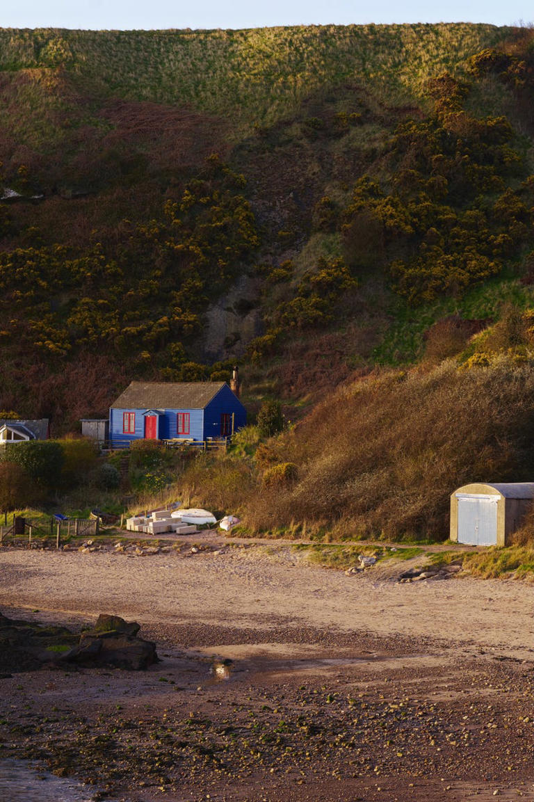 Inside a blue cabin 'on the edge of the world' – reached only by a rock ...