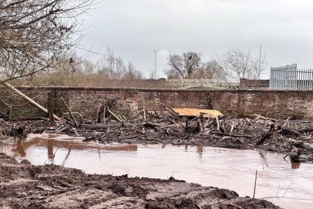 'I'm afraid historic bridge will collapse' says MP as flood debris piles up