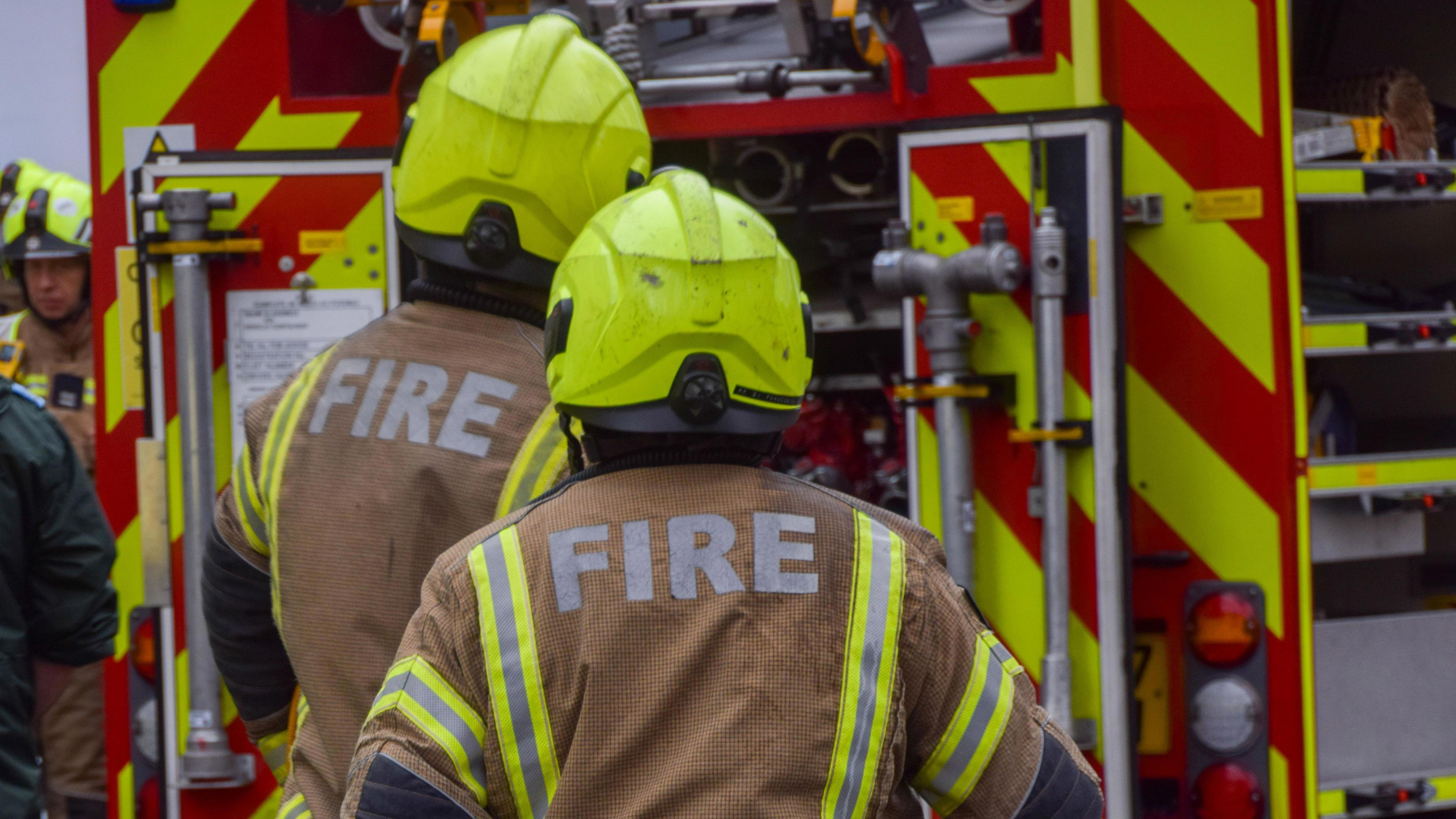 Man dies and homes evacuated after house fire
