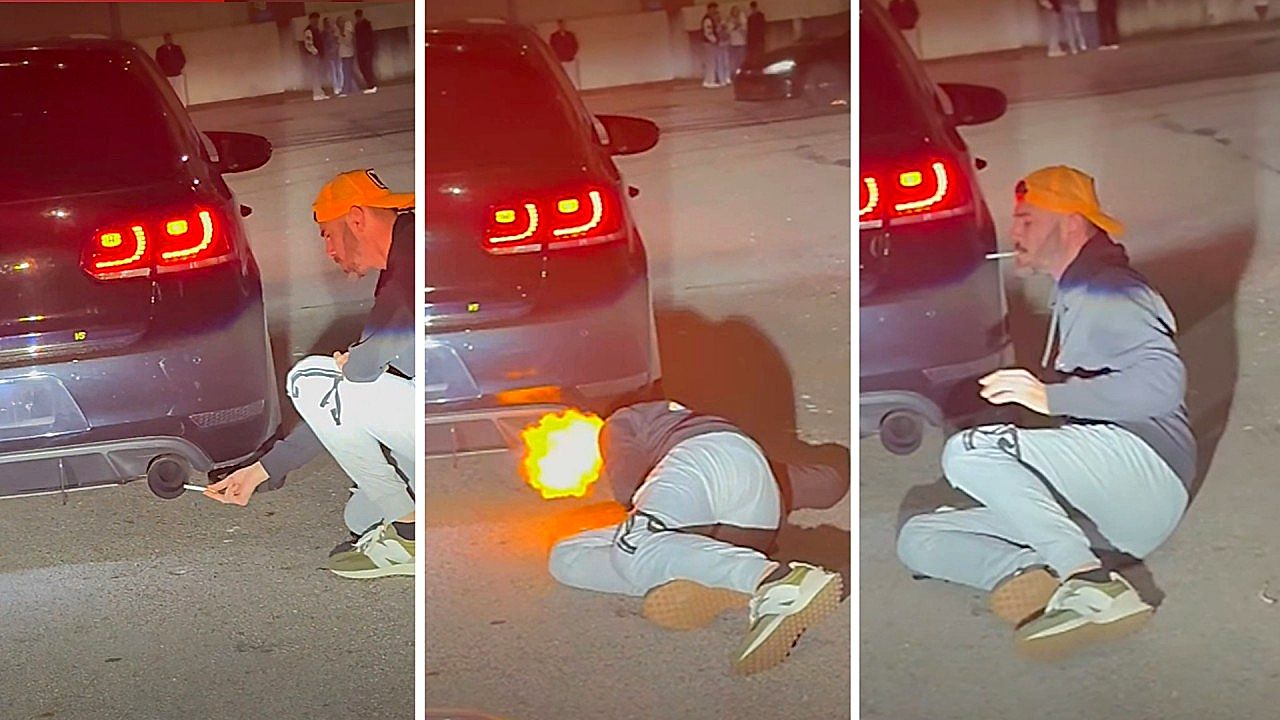 Man lights cigarette using car exhaust flames