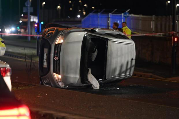 Person rushed to hospital after car overturns in crash on busy Bradford ...