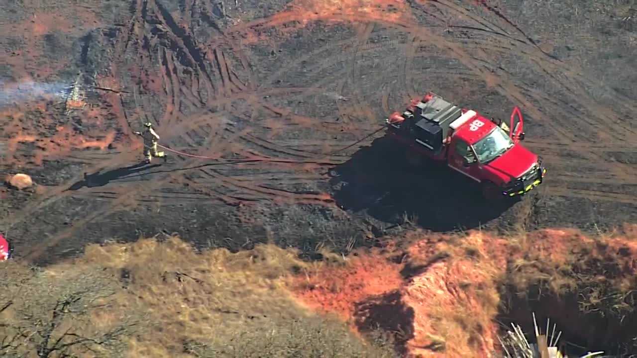 Sky 5 video shows crews battling grass fire near I-44 north of Jones