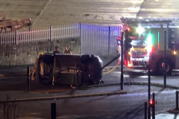 Huge emergency presence at crash scene after car overturns on Bradford road