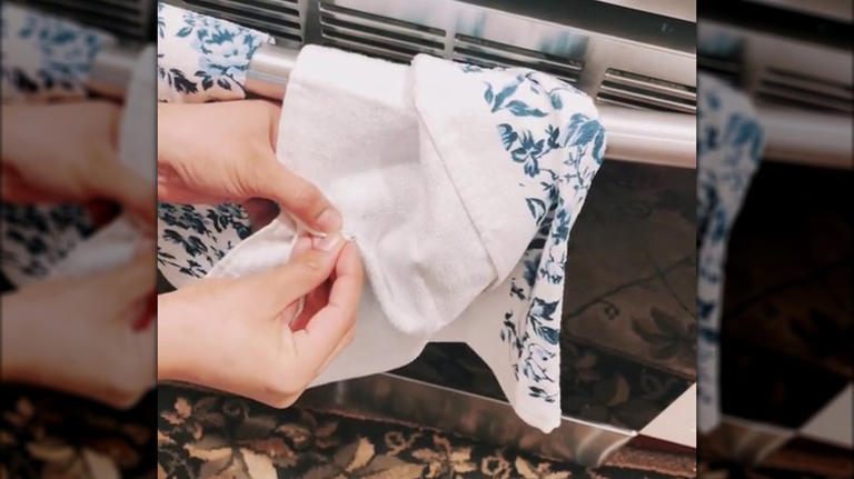 Stop kitchen towels from falling with a safety pin hack