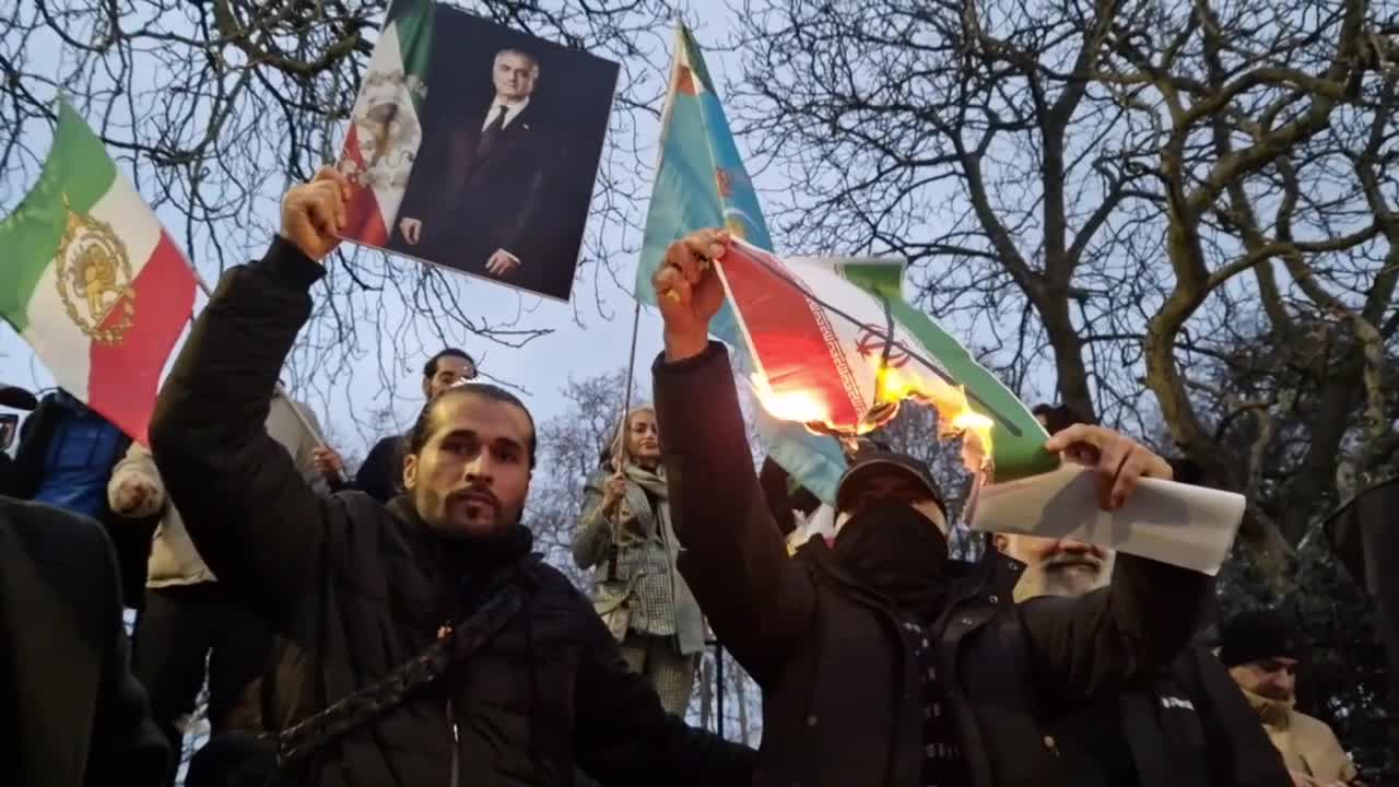 Pictures of the Ayatollah burn in London as protesters call for regime ...