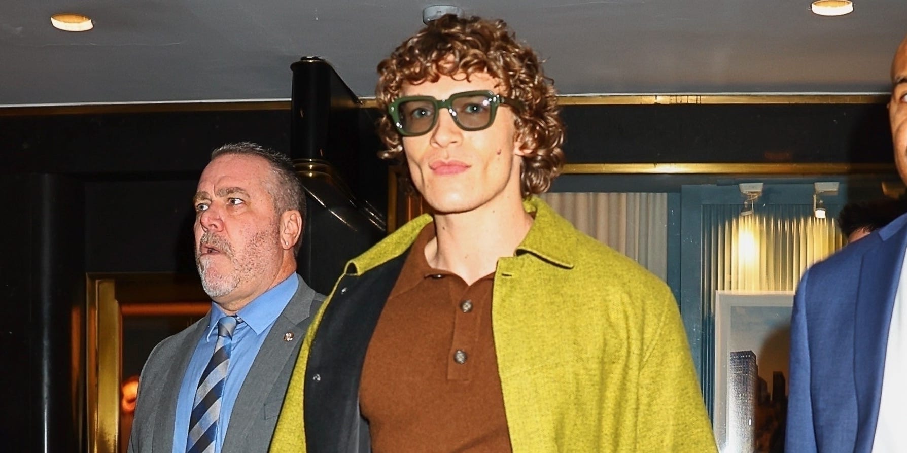 Connor Storrie nails colorblock dressing in a neon-green trench and ...