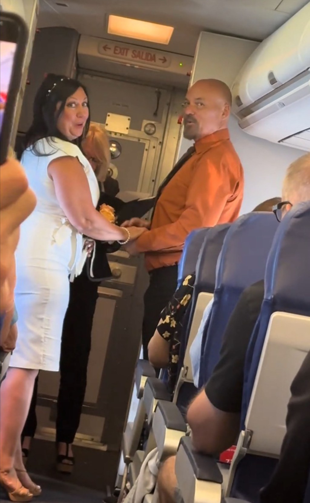Couple getting married in airplane aisle block bathroom access: 'I've ...