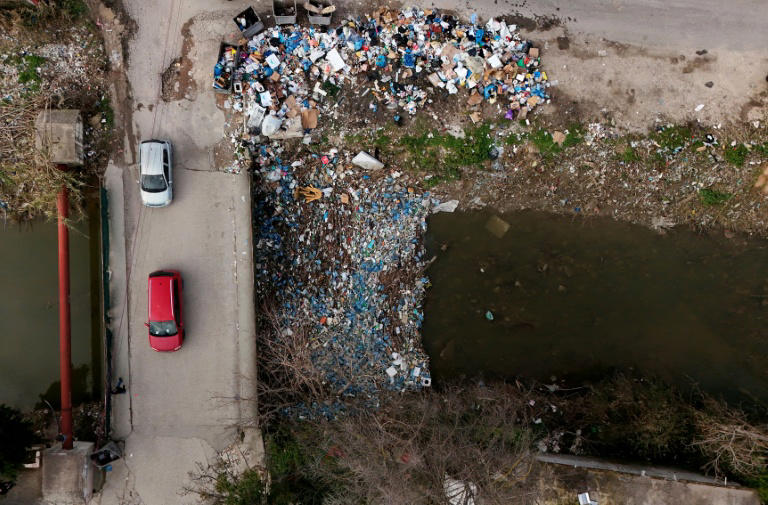 Albania's waste-choked rivers worsen deadly floods