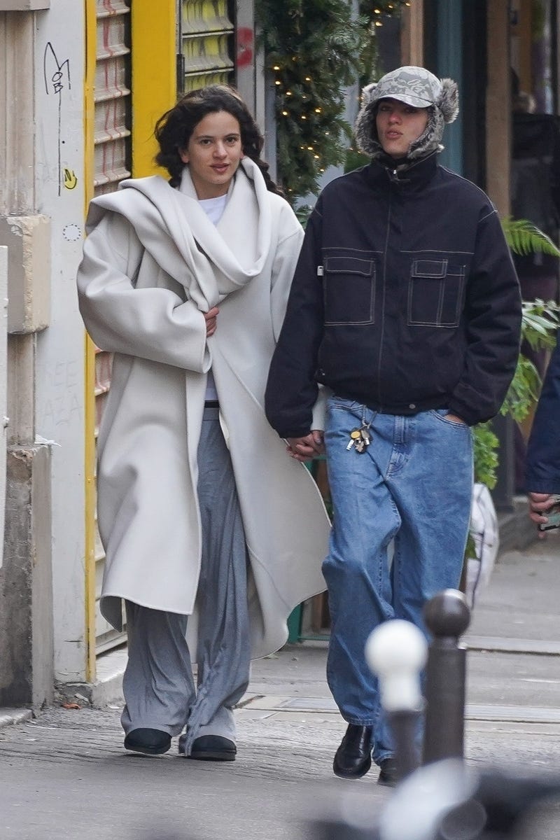 Rosalía’s scarf coat is so lux it nearly steals the show from her new ...