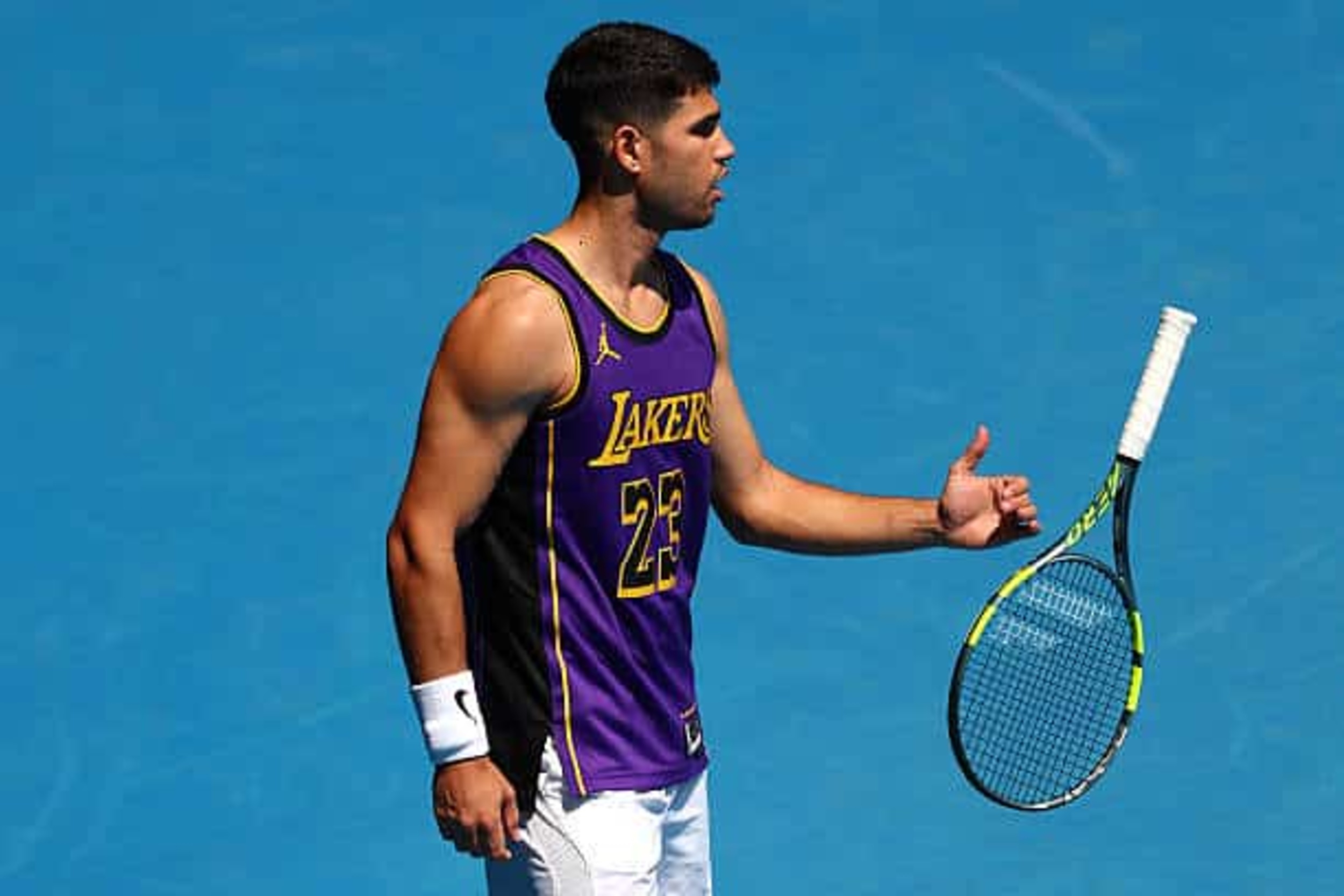 Carlos Alcaraz sports LeBron James Lakers jersey during Australian Open ...