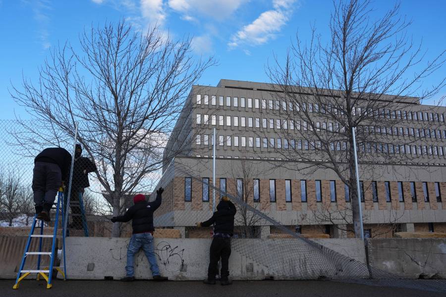 Fence up around Minneapolis protest site as state officials sue DHS