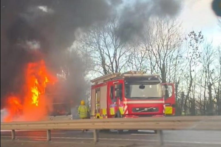 The moment fire rips through A55 bus captured in these dramatic images