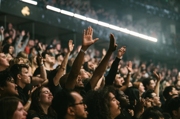 John Piper on whether raising hands in worship is 'showing off'
