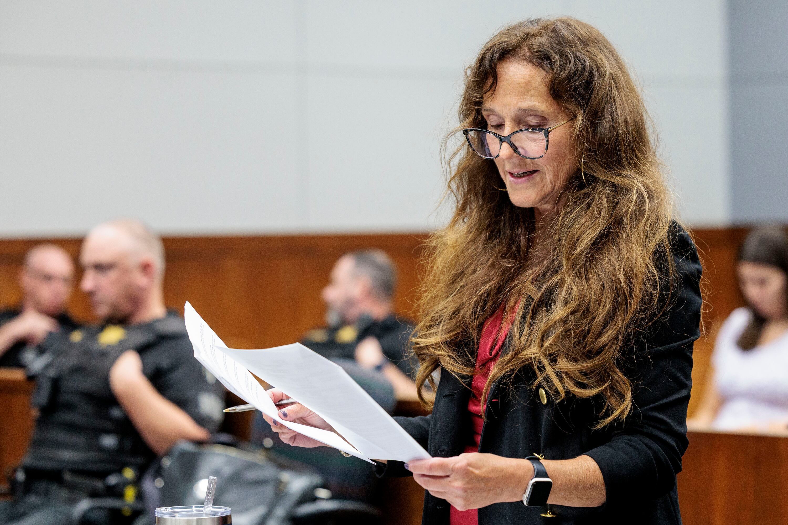 Woman accused of fatally shooting foster family sent to competency ...