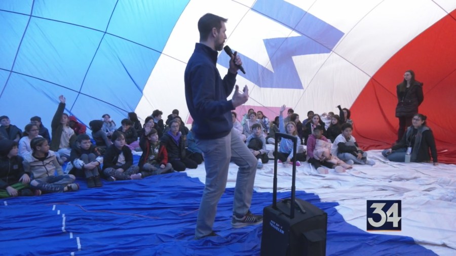 Local elementary school students learn inside hot air balloon