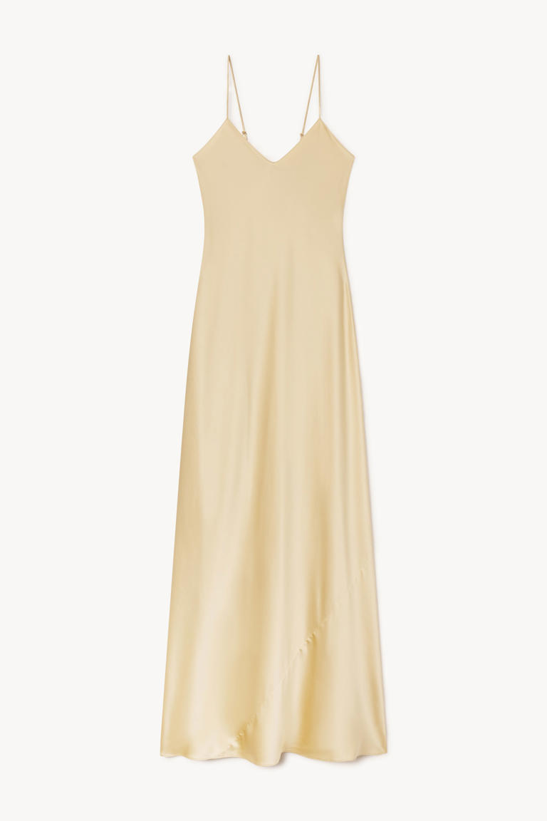 Emily Bader nails rom-com main character dressing in a satin slip dress