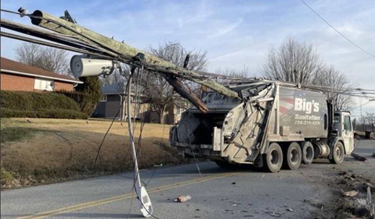 Garbage trucks takes out utility pole, brings down wires in Washington