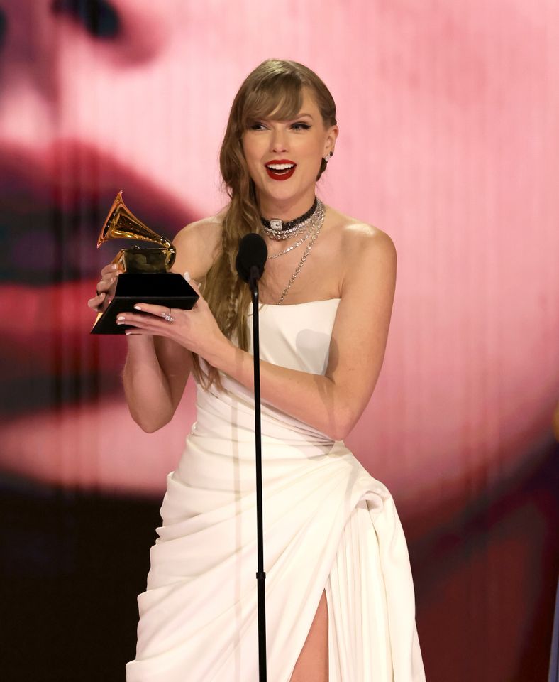 Taylor Swift pairs her peacoat with a surprising white miniskirt for a ...