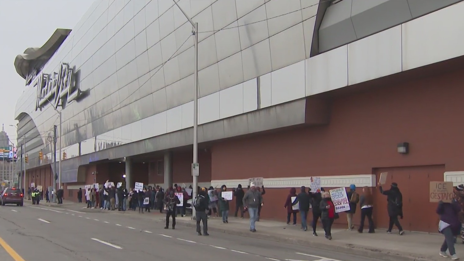 Protesters rally in Detroit during Trump's visit