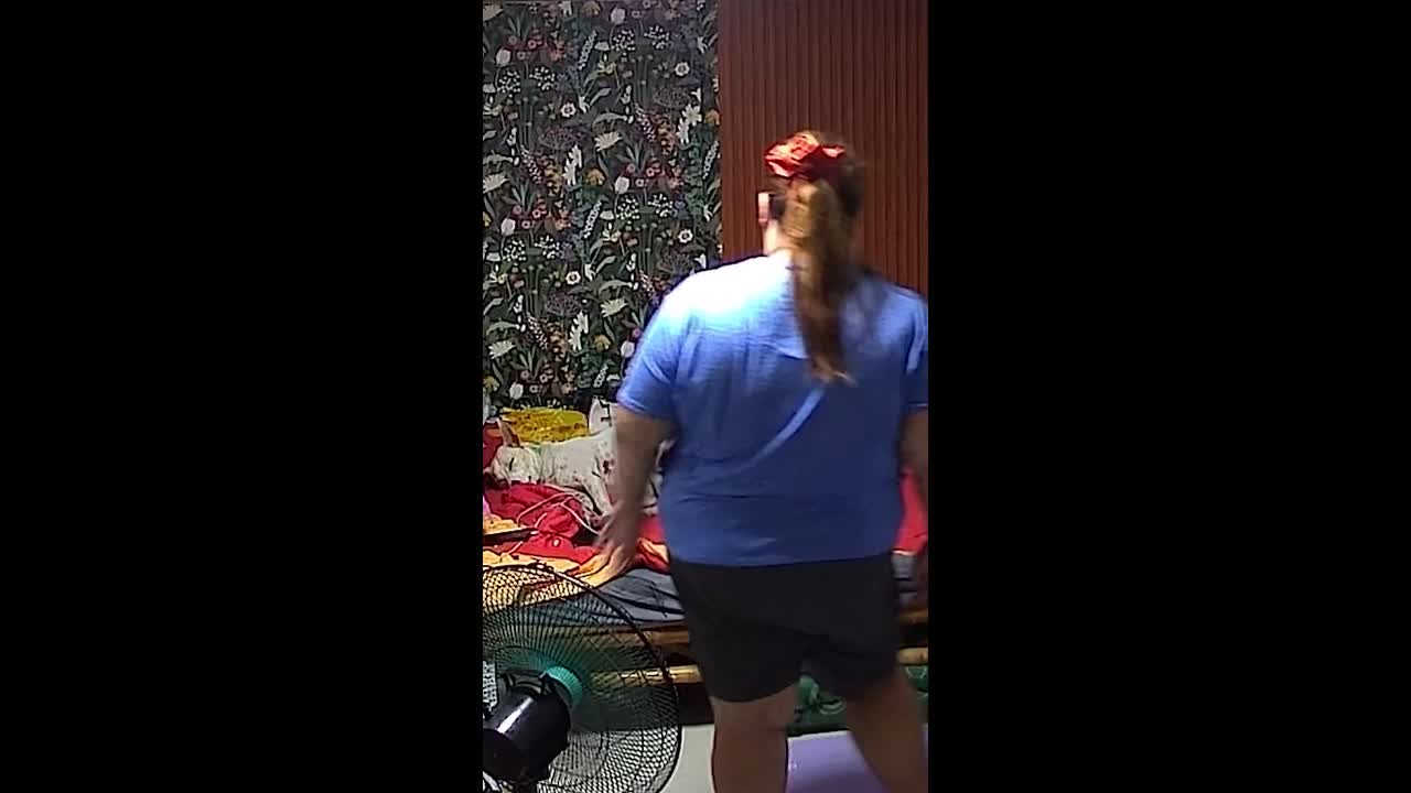 Confused dog wakes up to find owner exercising next to his bed