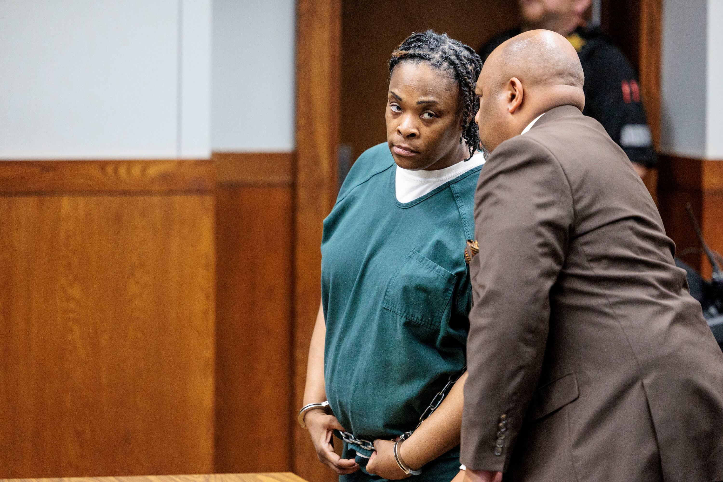 Woman accused of fatally shooting foster family sent to competency ...