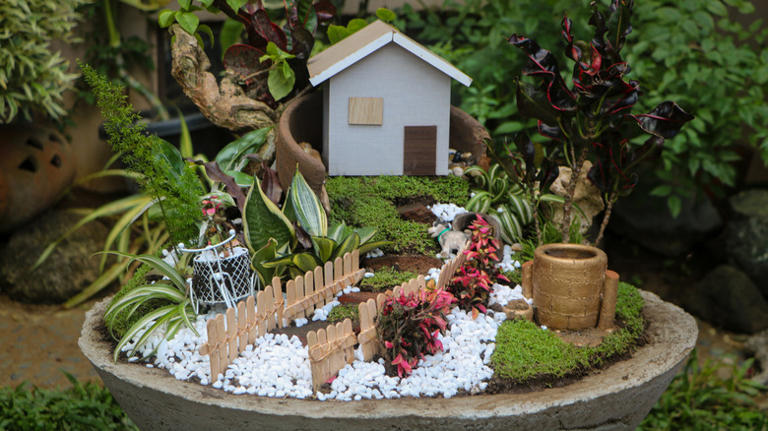 Turn any plant pot into an adorable fairy house with a Dollar Tree DIY