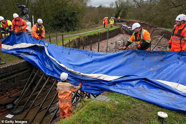 Deserted narrowboats are still stuck in the mud of drained canal weeks ...