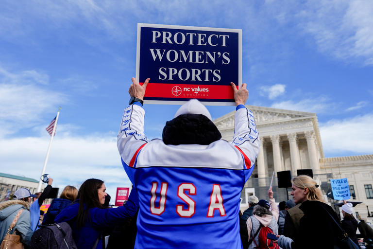 Photos of demonstrators outside the Supreme Court as it considers ...