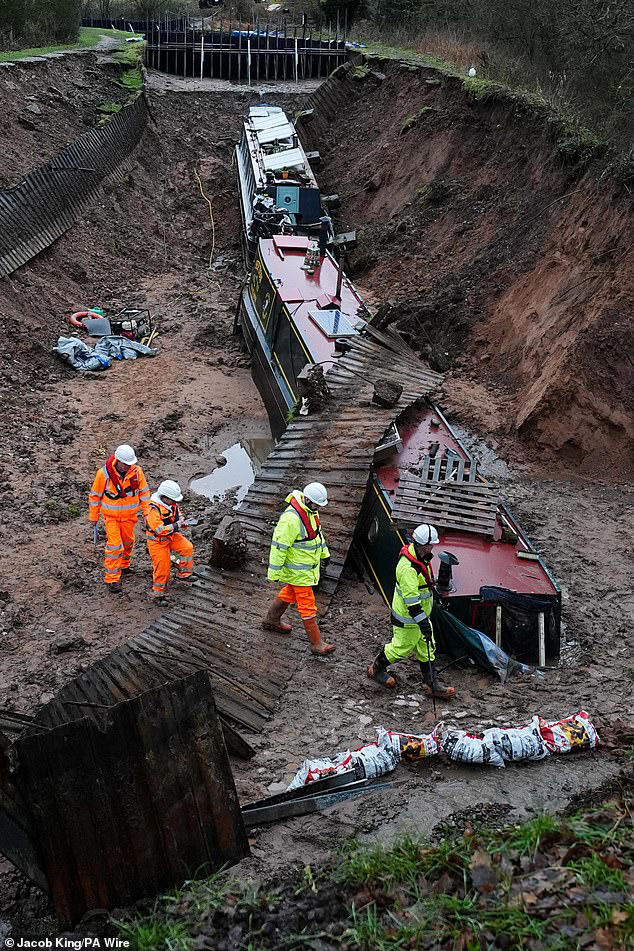 Deserted narrowboats are still stuck in the mud of drained canal weeks ...