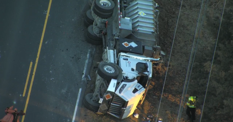 Tractor-trailer on side along Siler City road