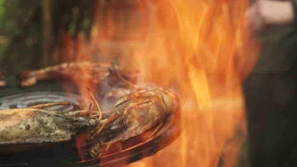 Tiger prawns cooked over open fire with butter