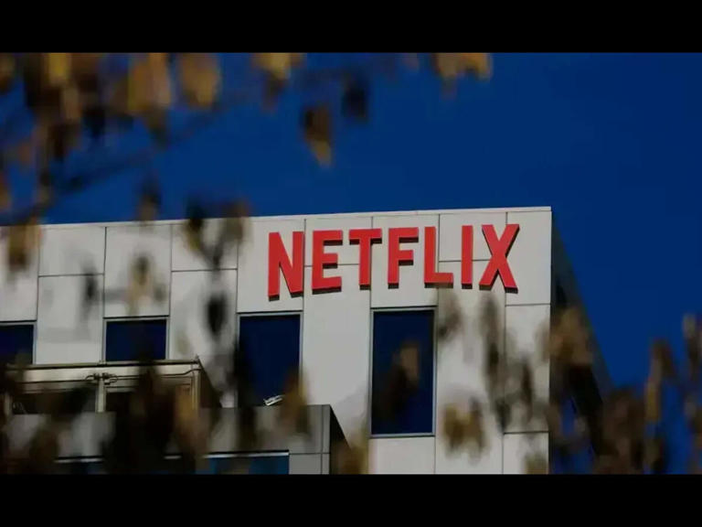 Netflix shares inch up on all cash deal for Warner Bros.