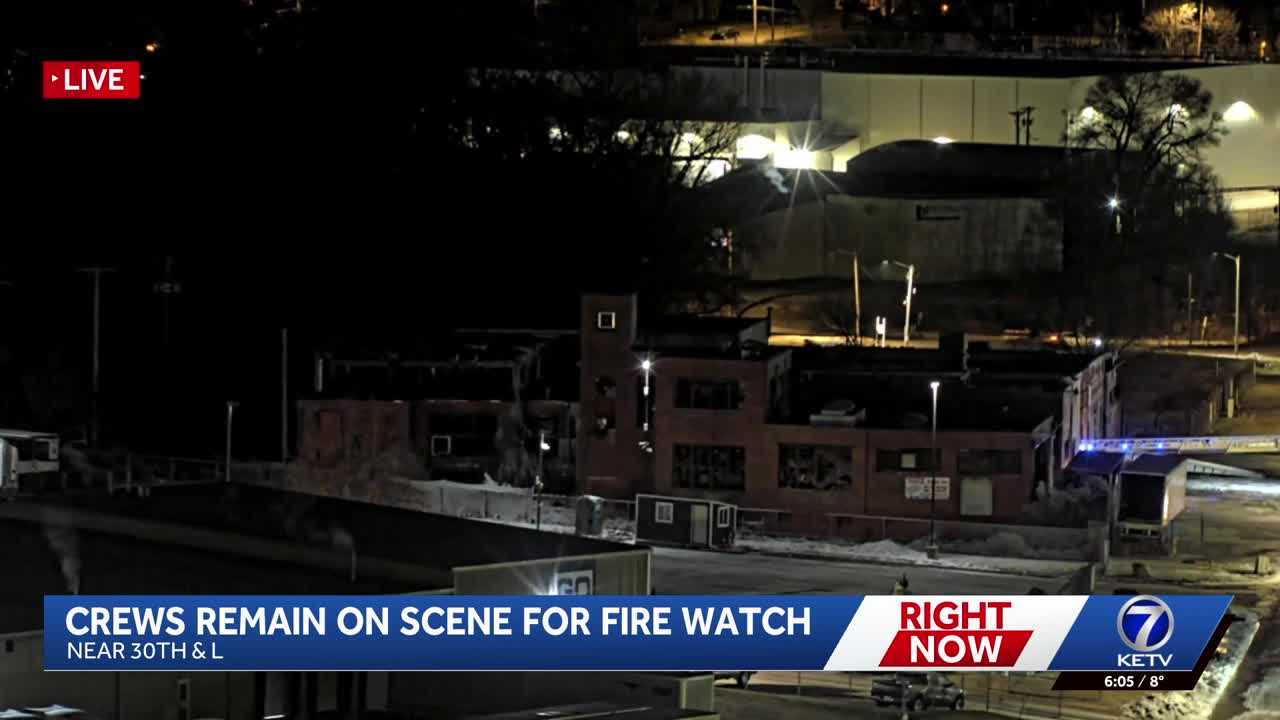 Crews still working to extinguish hot spots at warehouse fire in Omaha