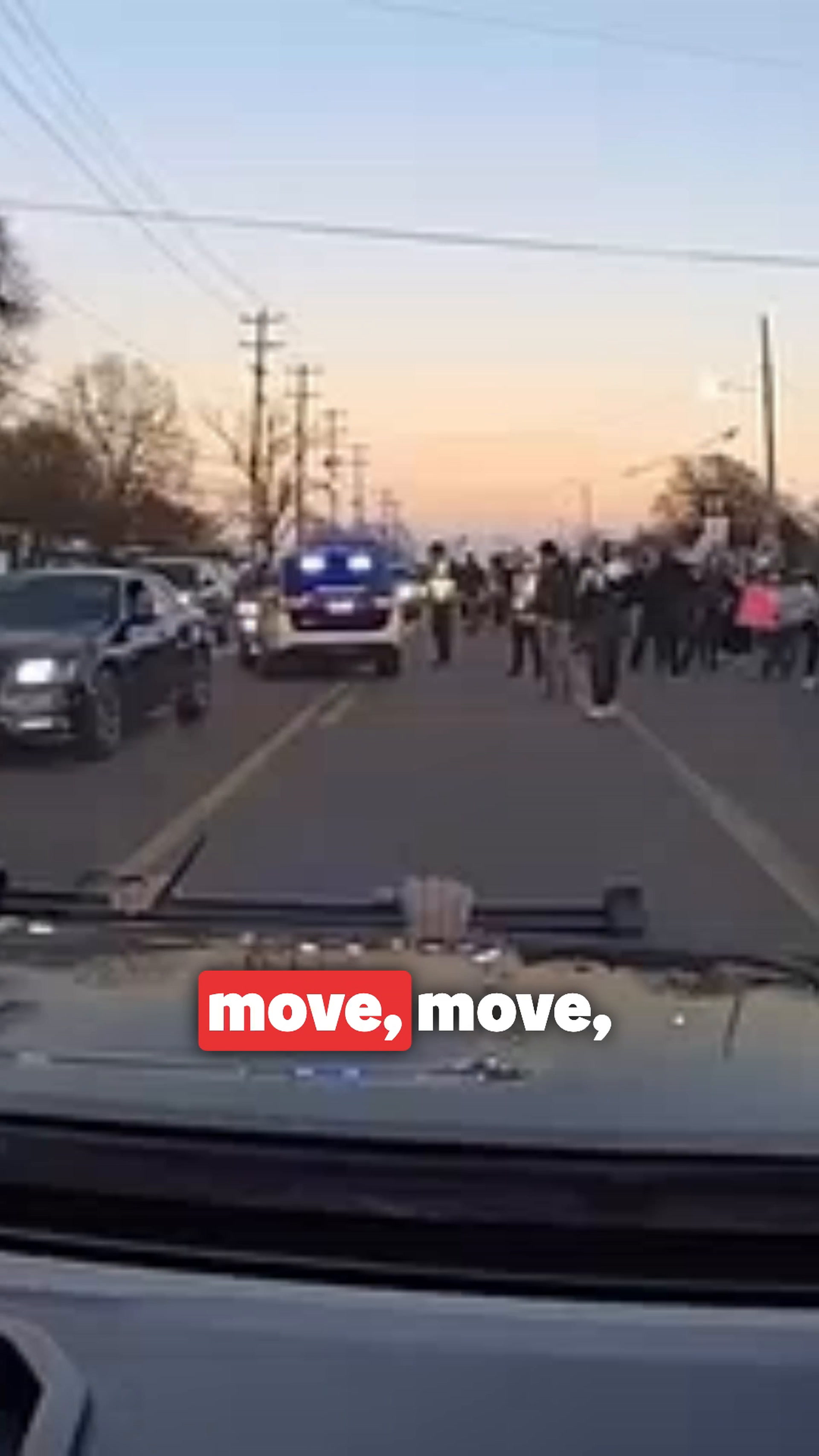 Protester 'fakes' being struck by police patrol car during ICE ...