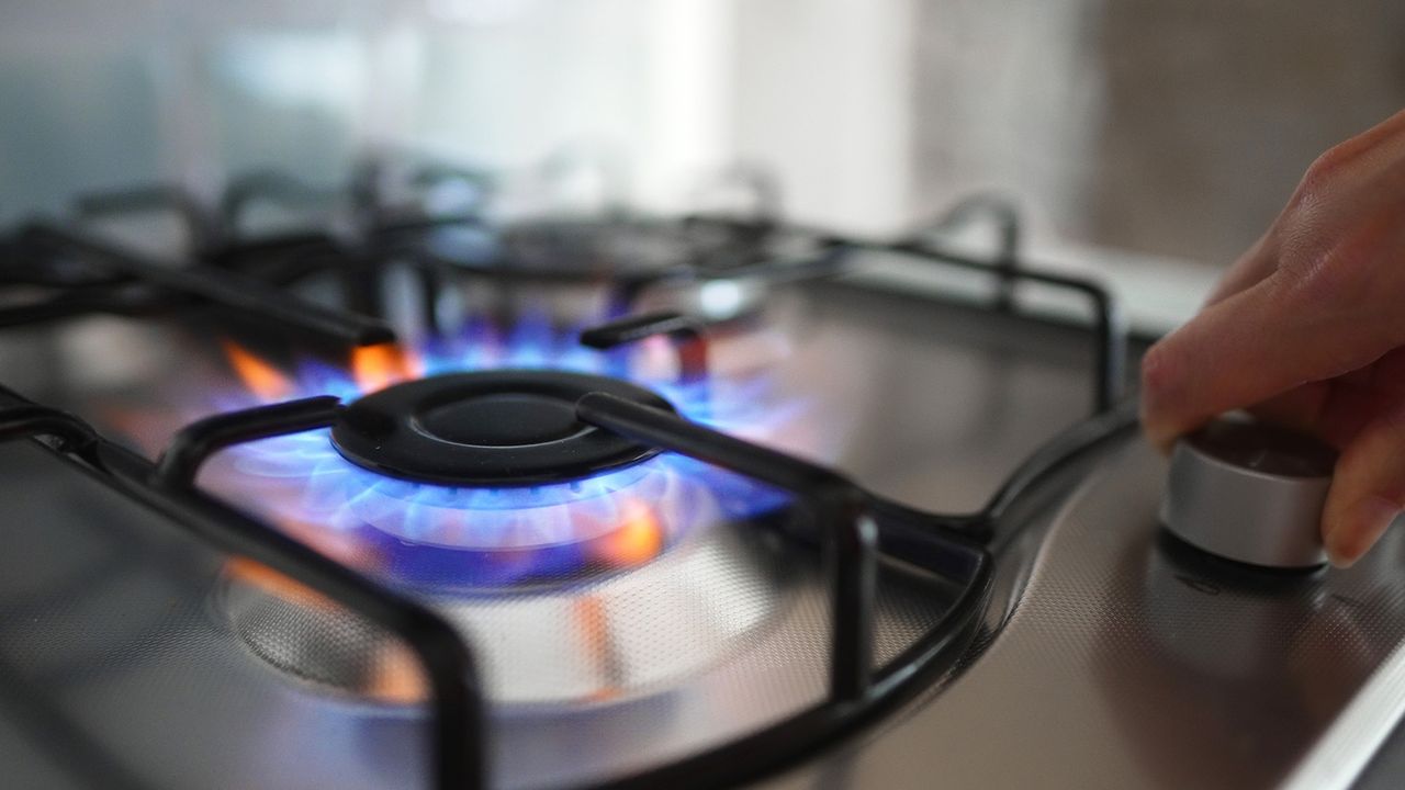Here’s why your gas stove flames turn orange, and whether it’s safe to ...
