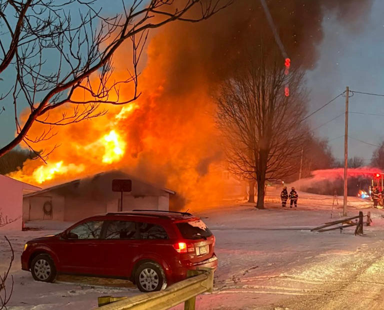 Hancock County fire departments battle house fire on Race Track Road