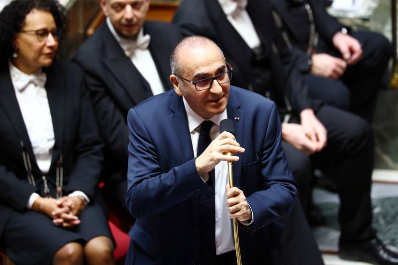 French PM forces part of budget bill through lower house without vote