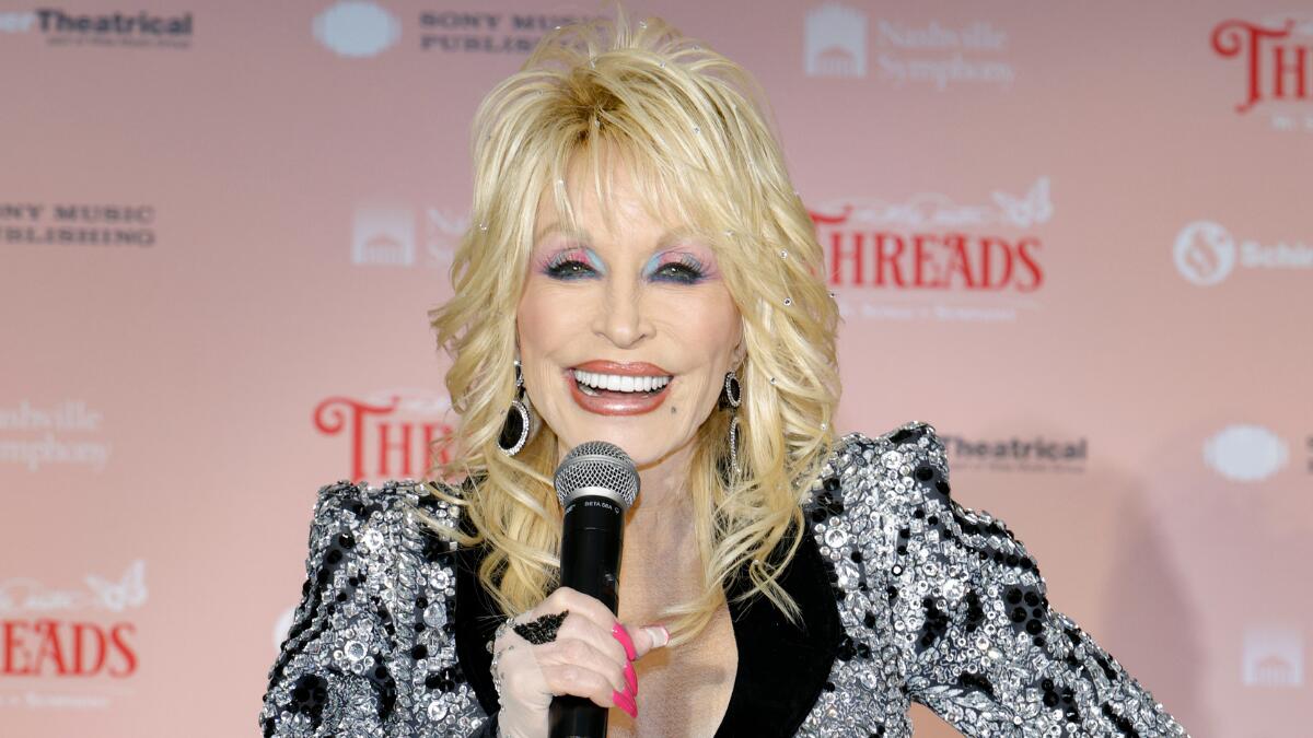 Watch Dolly Parton react to 80th birthday surprise from legendary artist