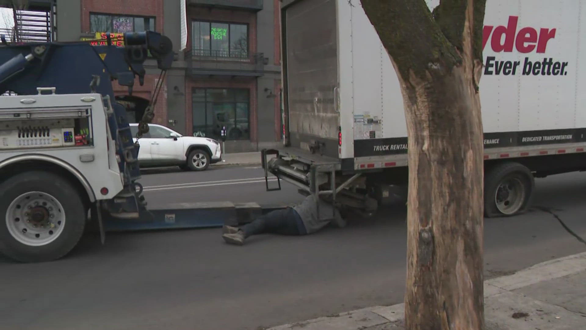 Moving truck gets stuck under Stevens Street bridge in downtown Spokane