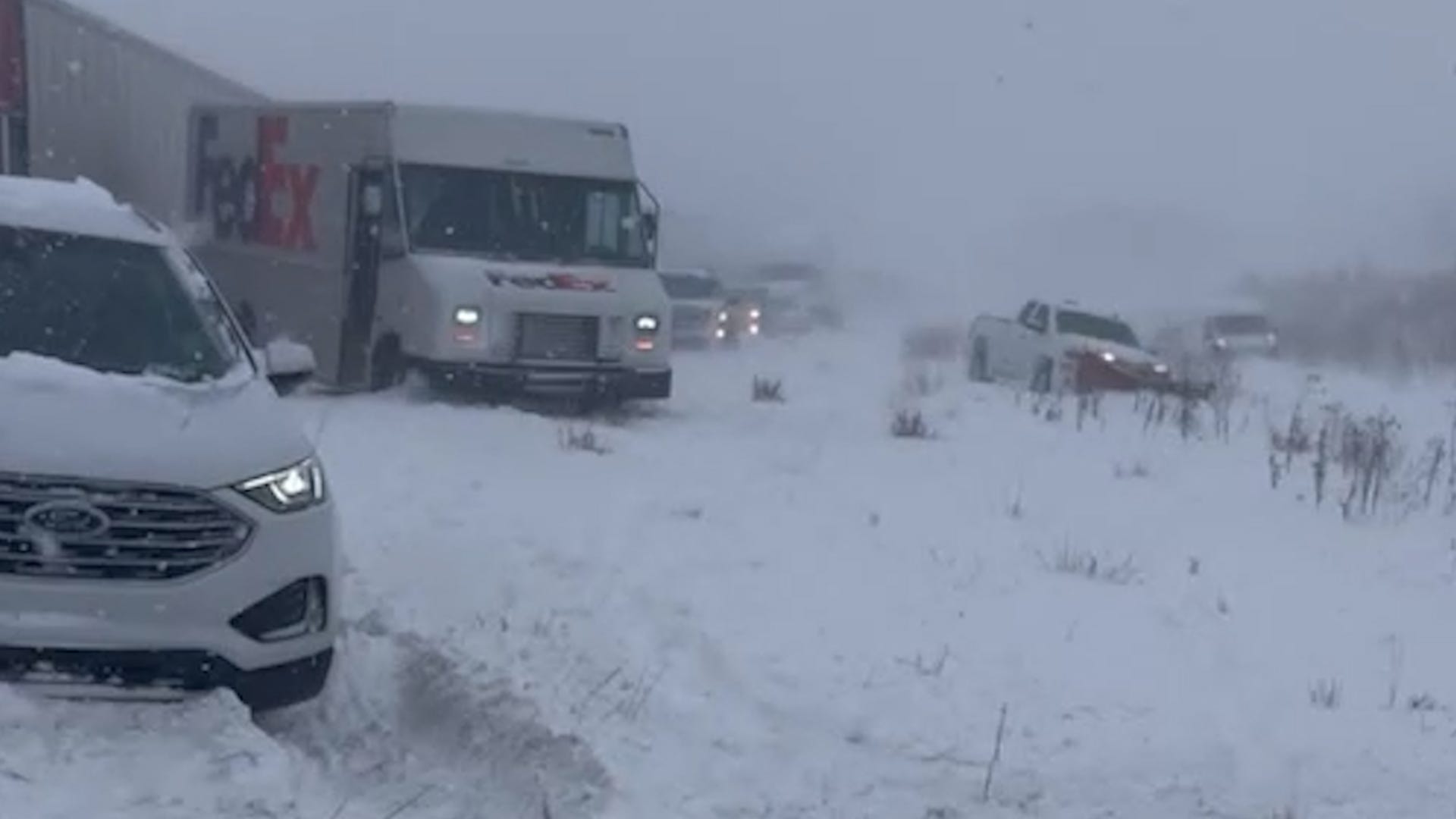 Watch driver walk through wreckage after 100-car pileup in Michigan