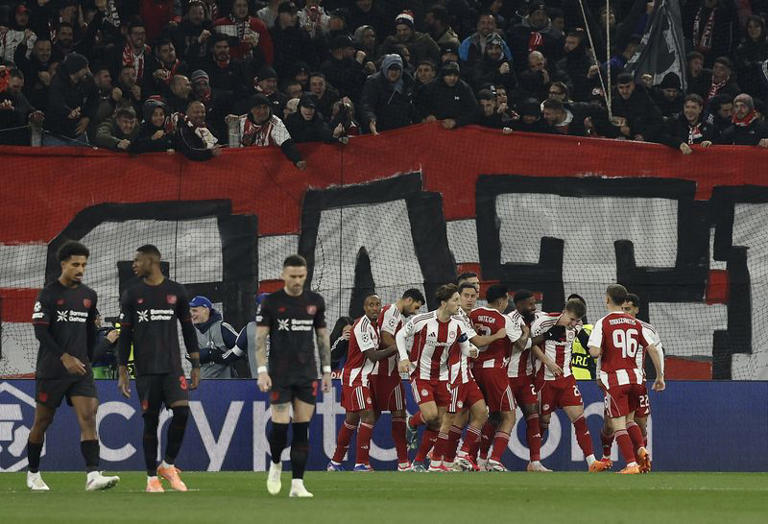 Soccer-Olympiacos power past Leverkusen 2-0 to keep alive qualifying hopes