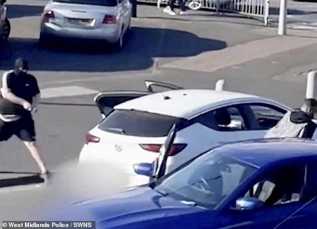 Moment thugs wield machetes and fire a gun during vicious street brawl ...